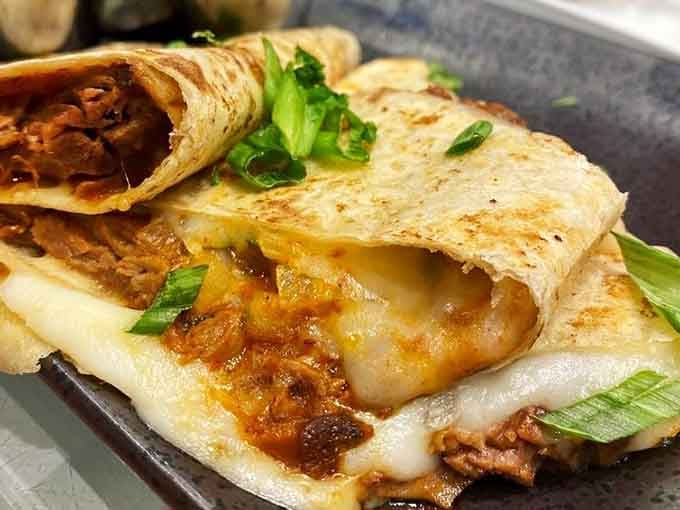 Birria quesadillas folded with the kind of precision that suggests someone really cares about your cheese-to-tortilla ratio happiness.