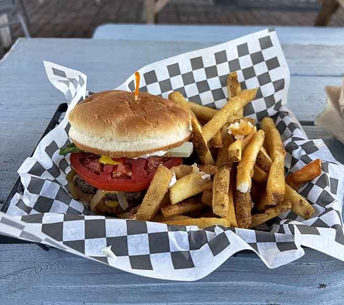 That burger sits in its checkered basket like it just won best in show, and honestly, no arguments here.