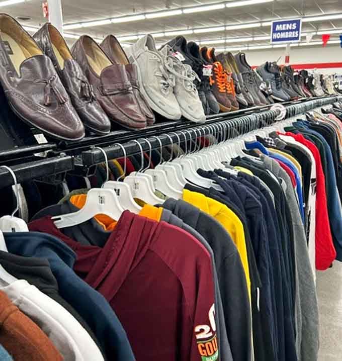 Men's shoes perched above clothing racks like a footwear museum, proving style doesn't require draining your retirement fund.