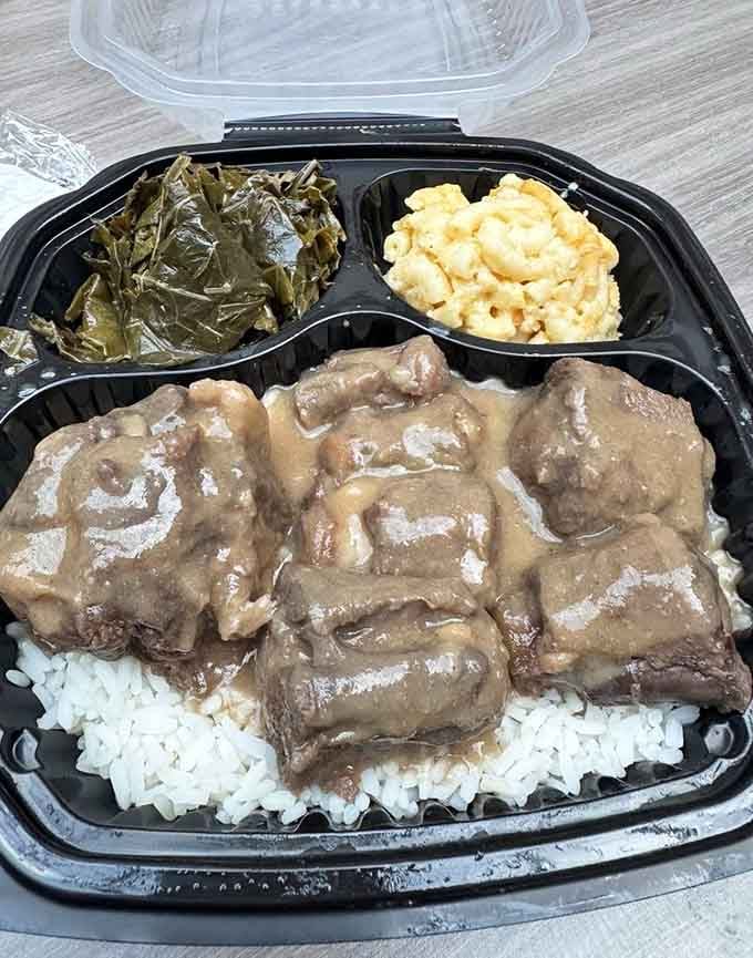 Oxtails so tender they surrender without a fight, swimming in gravy that deserves its own standing ovation tonight.