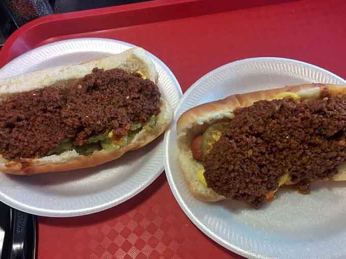 Two chili dogs proving that sometimes the messiest meals create the most memorable lunch breaks around here.