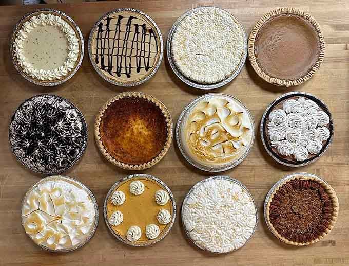 Twelve gorgeous pies lined up like edible works of art, each one begging to be your next dessert.