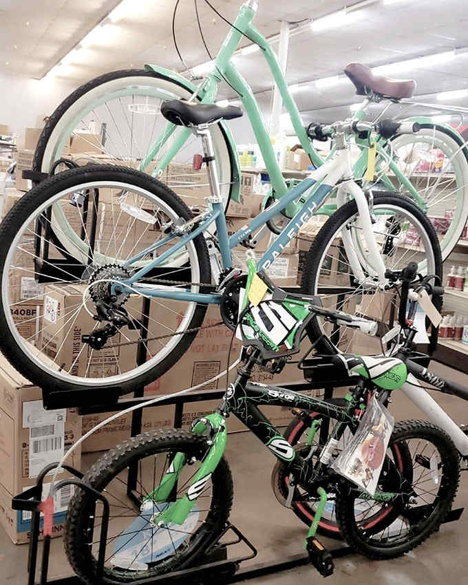 Bicycles stacked vertically because floor space is for amateurs and savings are for smart shoppers like you.