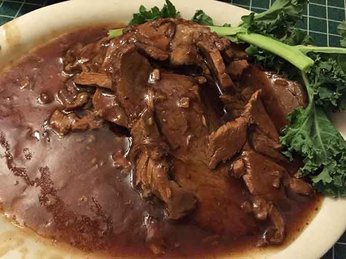 Tender roast beef swimming in rich gravy, the kind of comfort food that defines Midwestern hospitality.