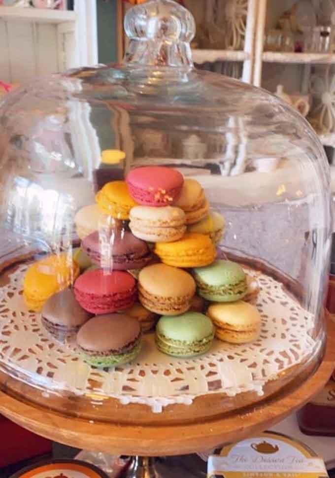 French macarons displayed under glass like edible jewels waiting to be discovered and devoured.
