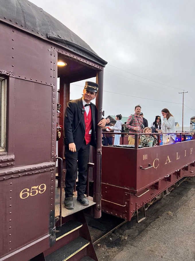 The conductor's period-perfect uniform adds theatrical flair to an already spectacular journey through California's forest cathedral.