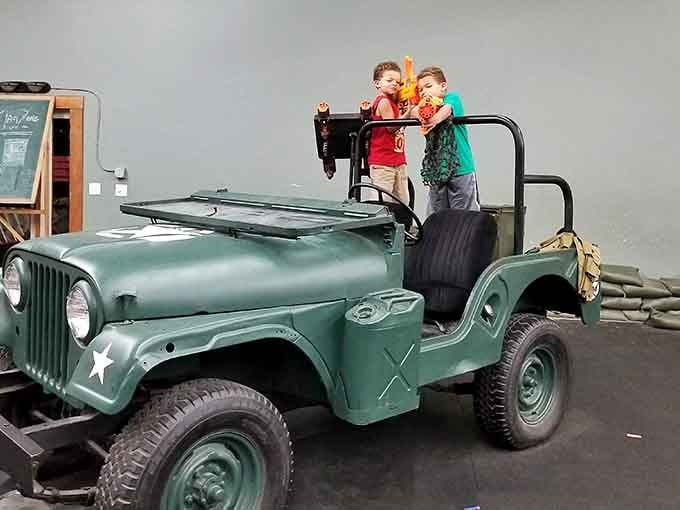That vintage military jeep isn't just decoration, it's your Instagram moment before the foam darts start flying.