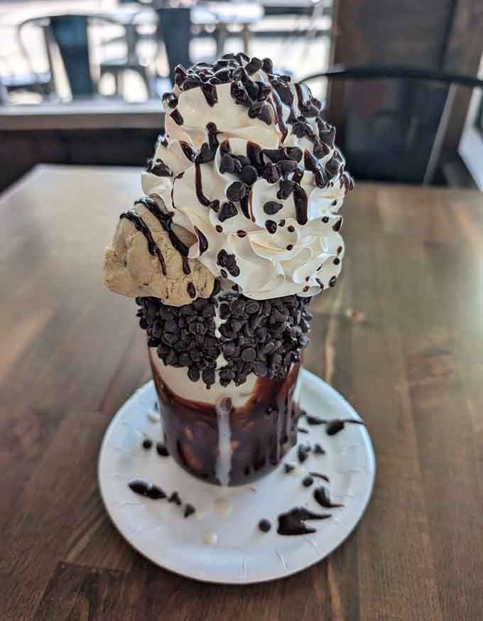 Chocolate drizzle, whipped cream mountains, and chocolate chips stacked so high it practically needs its own zip code.