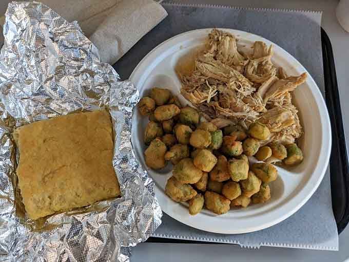 Pulled chicken, fried okra, and cornbread wrapped in foil like the world's most delicious present you give yourself.