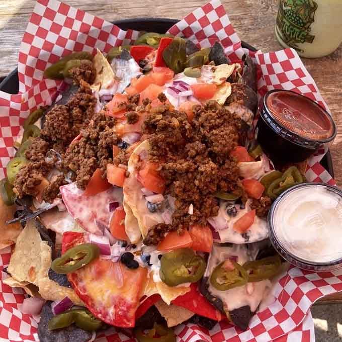 These nachos don't mess around, piled high like a delicious edible mountain range worth conquering.