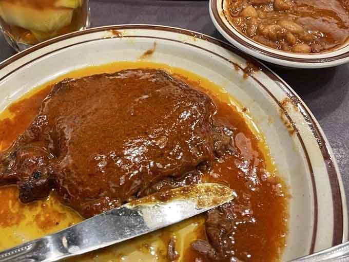 That's sliced beef swimming in its own juices, tender enough to cut with a stern look.