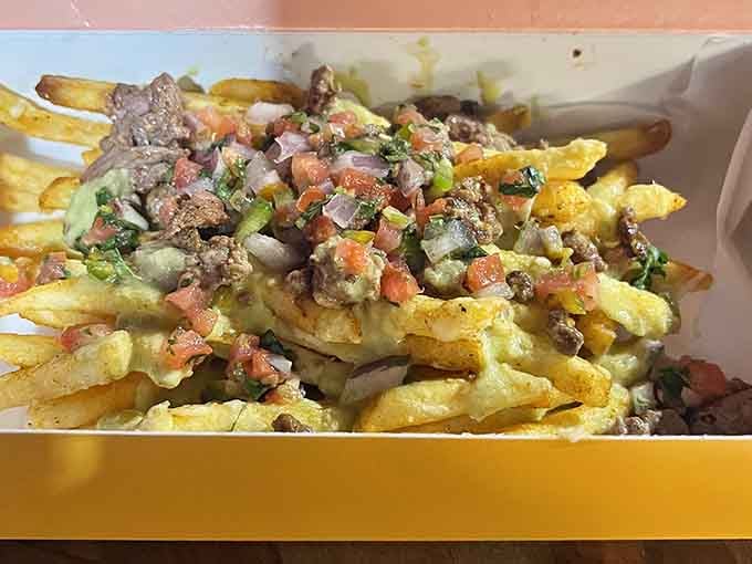 Loaded fries that understand the assignment: crispy base, generous toppings, and absolutely no regrets allowed here.
