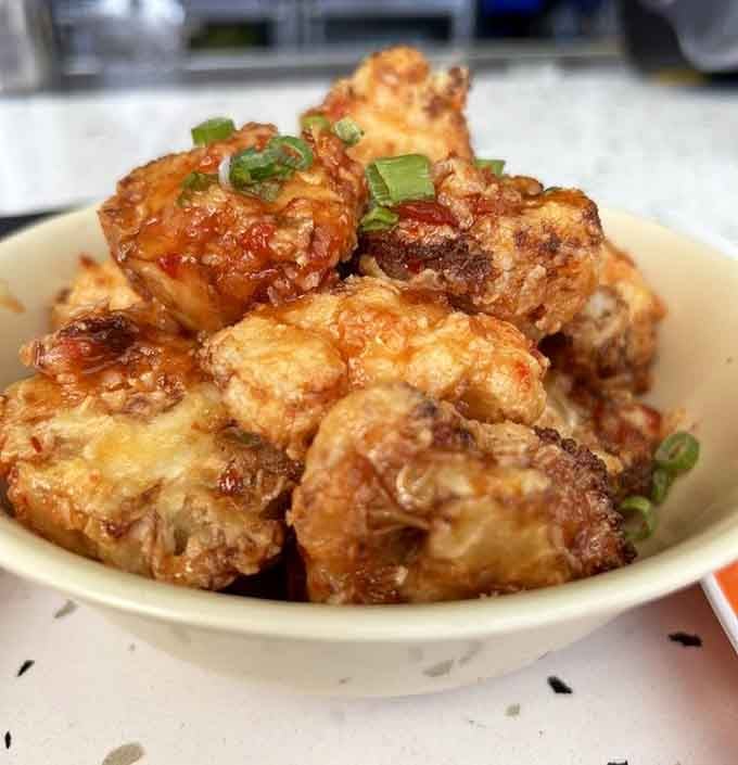 Golden fried cauliflower that'll convert even the most devoted vegetable skeptics into believers, one crispy bite at a time.