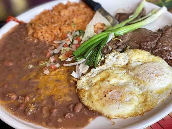 Steak and eggs with beans and rice&mdash;because sometimes breakfast needs to moonlight as the best meal ever.
