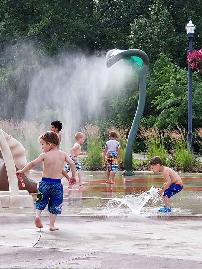 The spray park's dinosaur water feature proves that even extinct creatures can help cool off overheated Ohio kids on summer days.