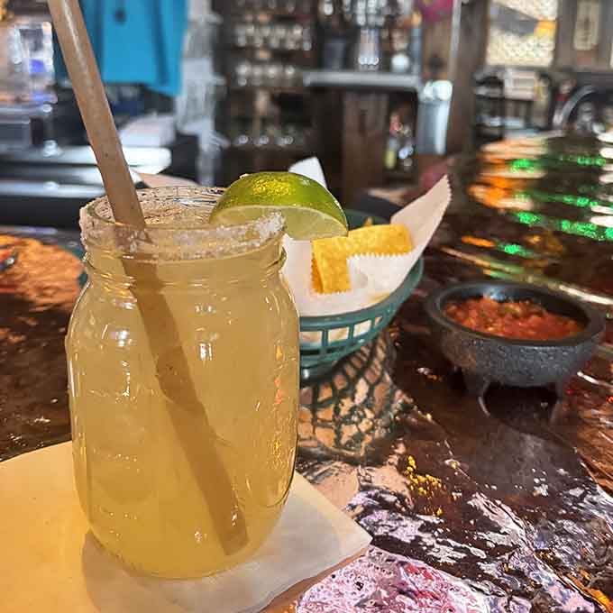That mason jar margarita with its salted rim is basically a vacation you can sip through a straw.