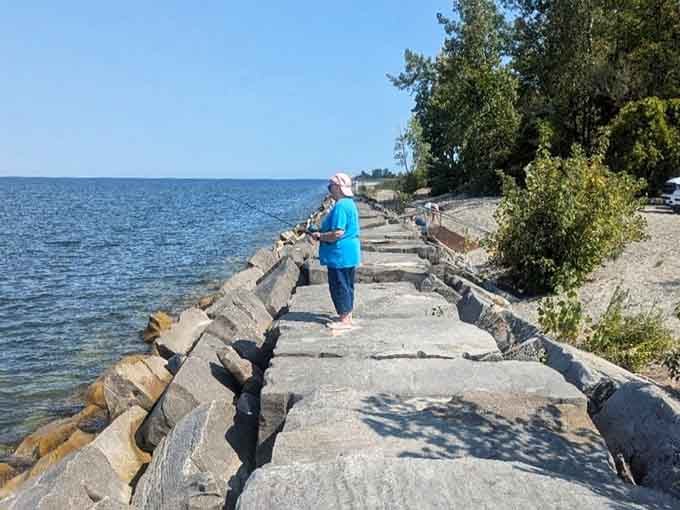 The breakwater extends like a stone pathway to nowhere, perfect for contemplative walks and pretending you're in a movie.