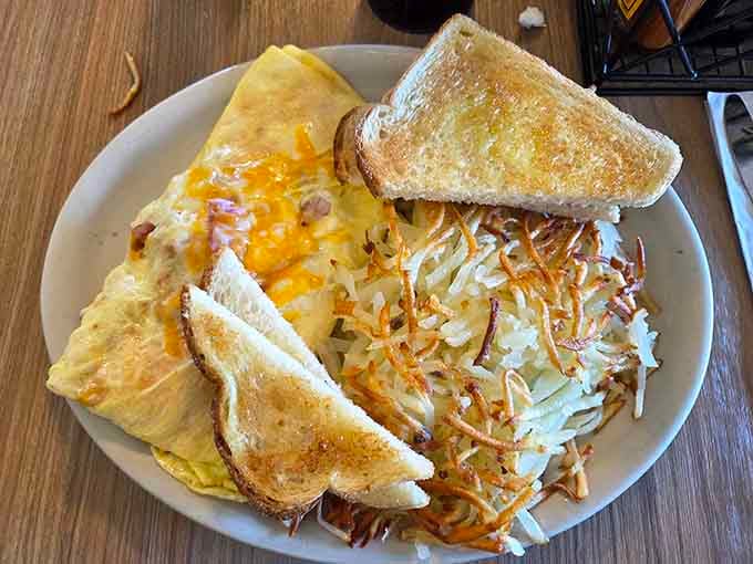 That omelet is stuffed with enough good things to make your cardiologist nervous and your taste buds ecstatic.