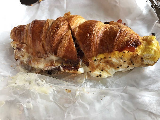 A flaky croissant cradling eggs and sausage is the kind of breakfast that makes hitting snooze worth it.