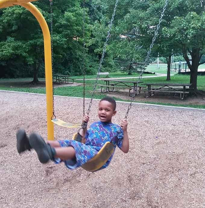 Pure joy captured mid-swing, proving the simplest pleasures still deliver the biggest smiles and best memories.