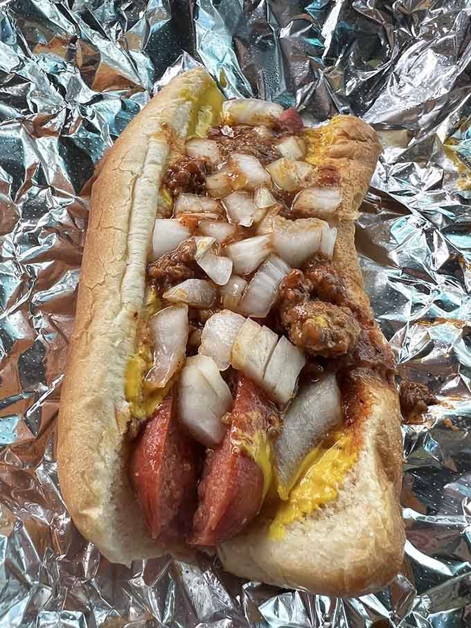 Chili, cheese, and onions transform a hot dog into something that requires both hands and complete focus.