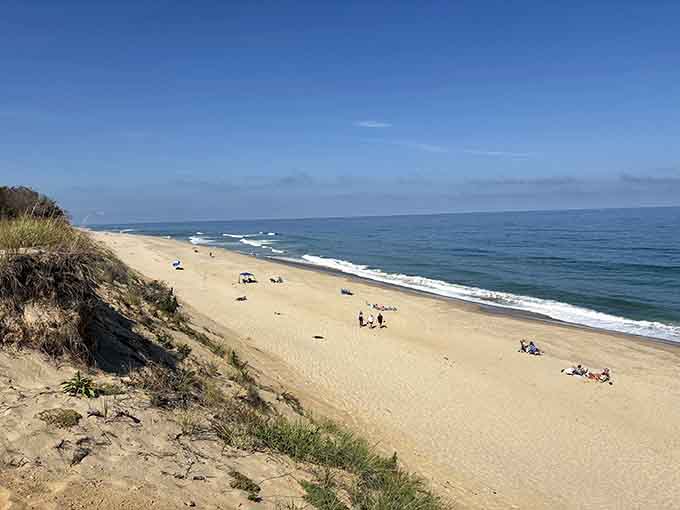 Miles of pristine sand stretch before you like nature's own private beach club, membership free.