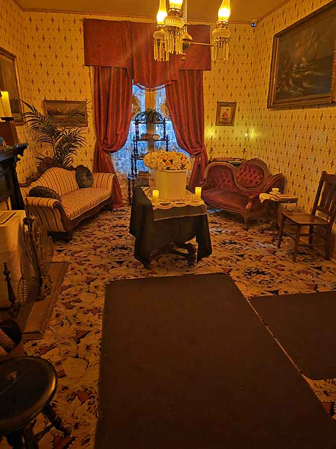 Elegant Victorian parlor where the living admire antiques and the departed apparently still enjoy entertaining guests after all these years.