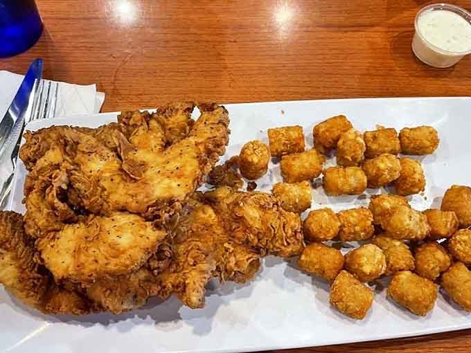 Golden chicken strips and tater tots prove that sometimes the simplest pleasures are the most satisfying ones.
