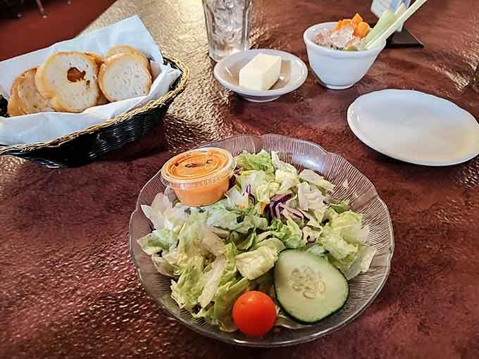 Fresh salad, warm bread, and relish tray: the holy trinity of supper club starters that never disappoints.