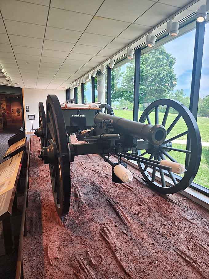Artillery pieces positioned by windows overlook the very ground they once defended with deadly precision.