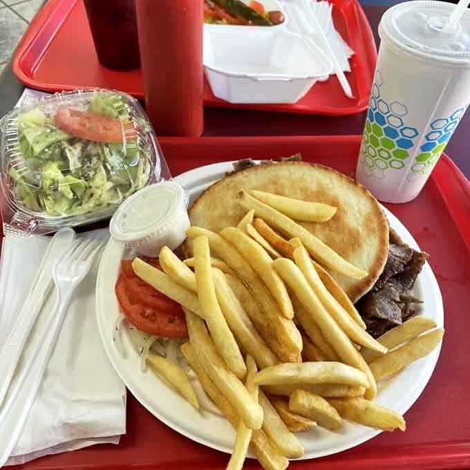 This gyro plate comes loaded with crispy fries and enough meat to fuel your entire afternoon nap schedule.