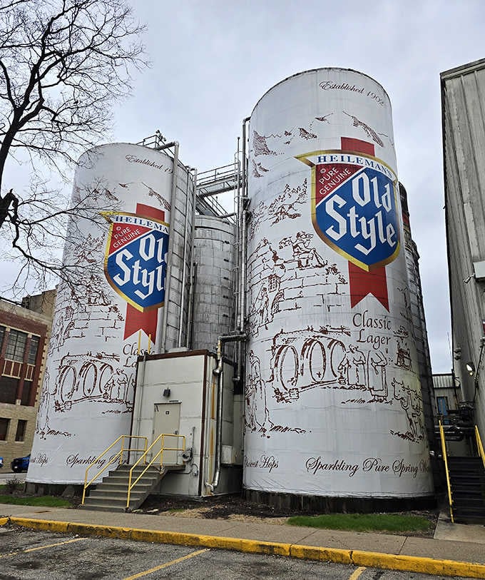 The industrial piping and ladders remind you these beauties actually work, storing real beer behind those painted labels.