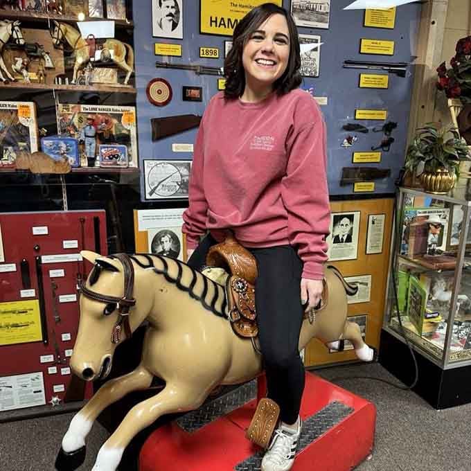 That smile says it all: finding your childhood joy on a coin-operated horse never gets old.