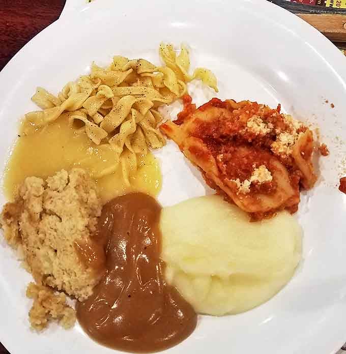 Brown butter noodles swimming in gravy alongside mashed potatoes&mdash;this is what carbohydrate heaven looks like on a plate.