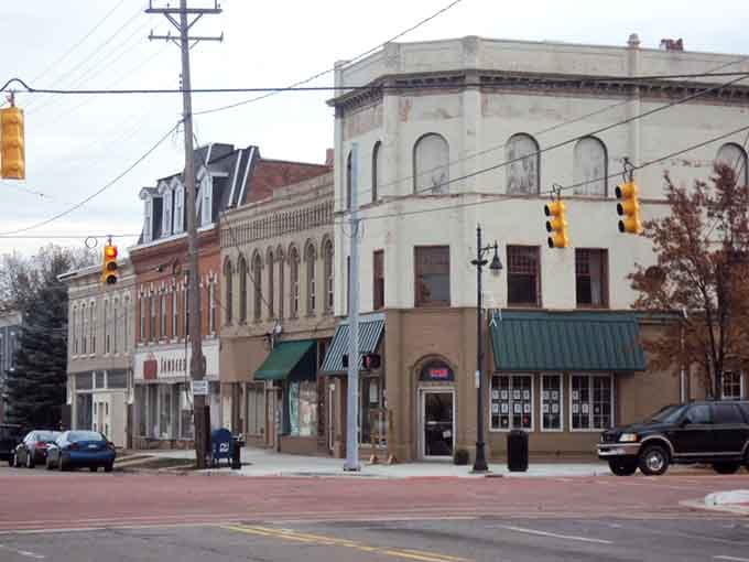 Albion's vintage buildings stand shoulder to shoulder, weathered but dignified, like retirees who've earned their comfortable years.