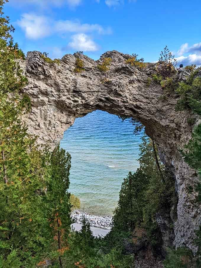 Nature's own picture frame: limestone carved into a perfect window overlooking turquoise waters that seem impossibly blue.