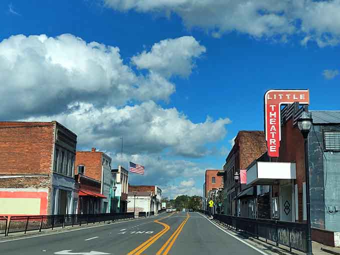 That vintage theater marquee and dramatic sky create a scene straight out of a classic movie you'd actually watch.