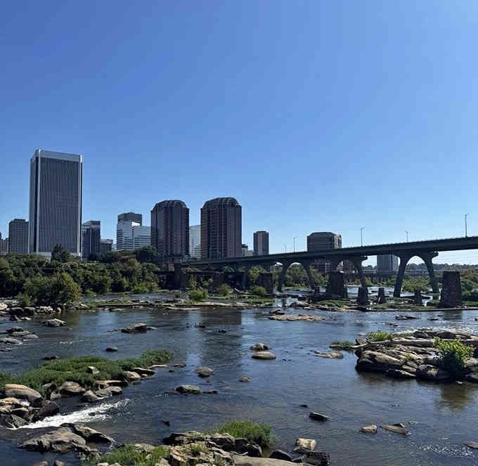 City skyline meets rushing river in a view that proves urban and natural can be best friends.