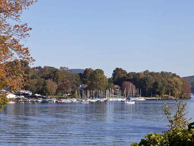 Sailboats clustered at the marina create a postcard-perfect scene that screams lazy summer afternoons and good decisions.