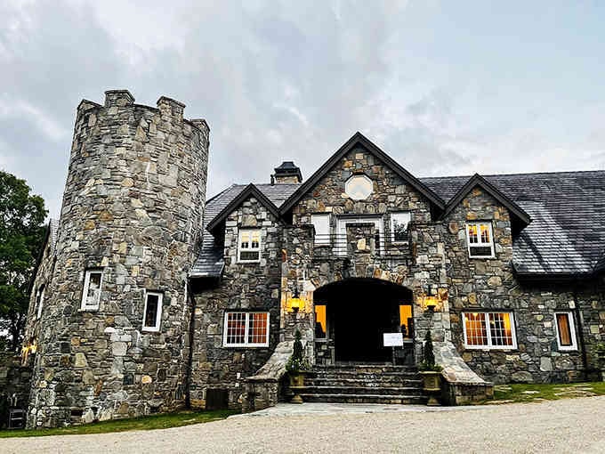 Warm light glows from windows in weathered stone walls that have witnessed countless celebrations and memories.