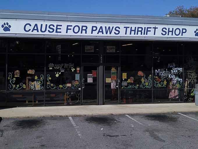 Playful paw prints dance across the windows, celebrating the furry friends your shopping helps rescue and rehome.