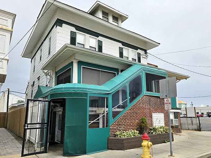 That turquoise trim against white siding whispers "incredible Italian food lives here" louder than any neon sign ever could.