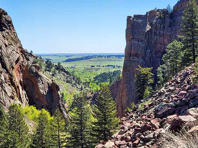 Towering red cliffs framing green valleys below&mdash;like looking through nature's own picture window into paradise itself.