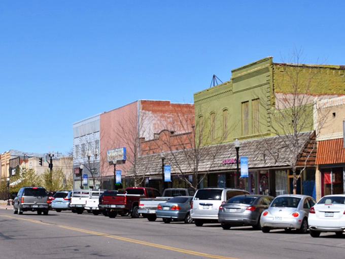 Colorful storefronts pop against blue skies in this downtown where parking meters don't cost more than lunch itself.