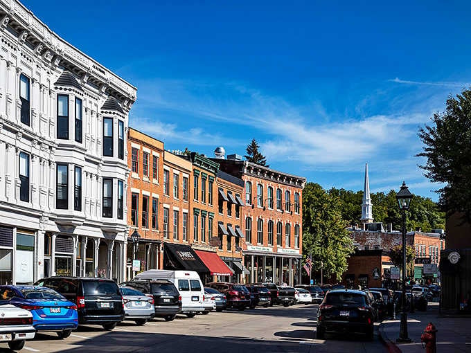 Historic brick facades climb the hillside in warm orange tones, creating a Main Street that looks like a movie set.