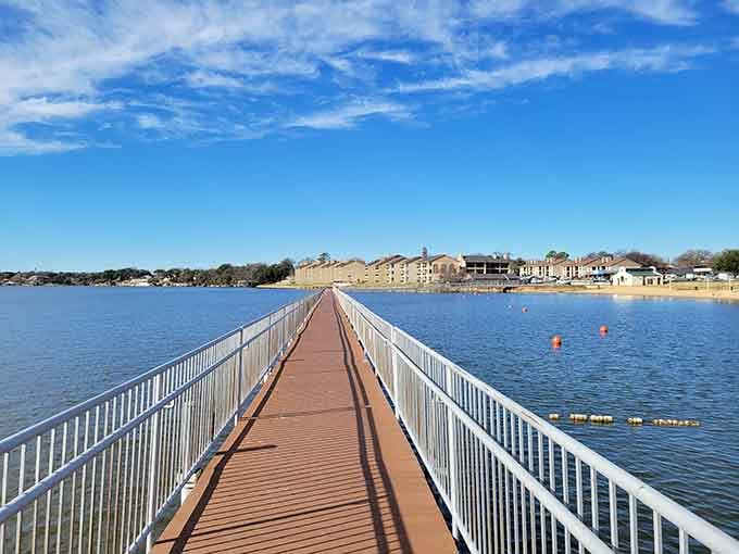 This pier stretches across calm waters like a red carpet rolled out just for your lakeside stroll.