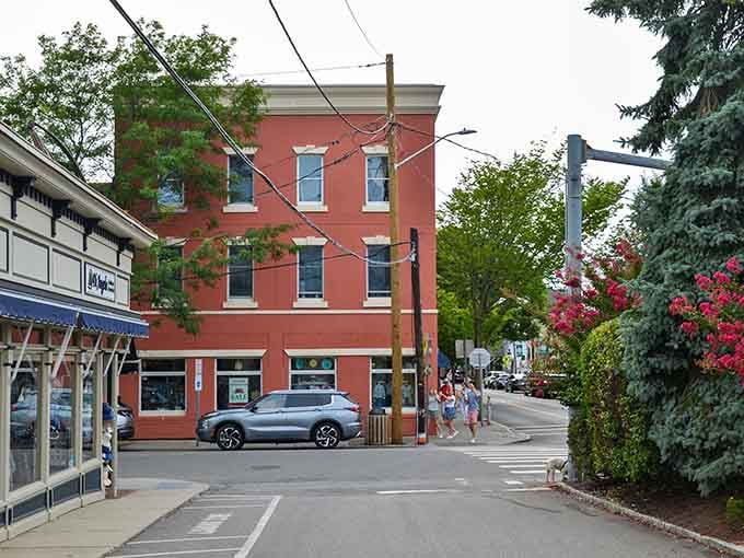 Coral-colored buildings and blooming flowers create a cheerful streetscape that lifts your spirits the moment you arrive.