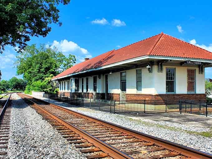 That distinctive red tile roof catches the eye from blocks away, a Mediterranean touch in the Heart of Dixie.