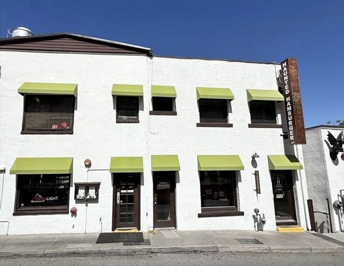 Those cheerful green awnings on white walls give this historic building character that matches the burgers inside perfectly.