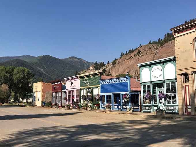 Lake City's quiet main street stretches toward distant peaks, offering small-town charm without the tourist crowds elbowing for space.